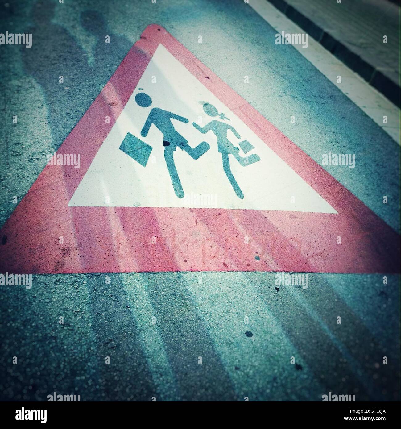 Pedestrian shadows on school crossing sign on road Stock Photo - Alamy