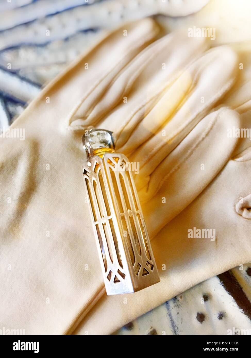 Vintage sterling silver perfume vial and white gloves still life Stock ...