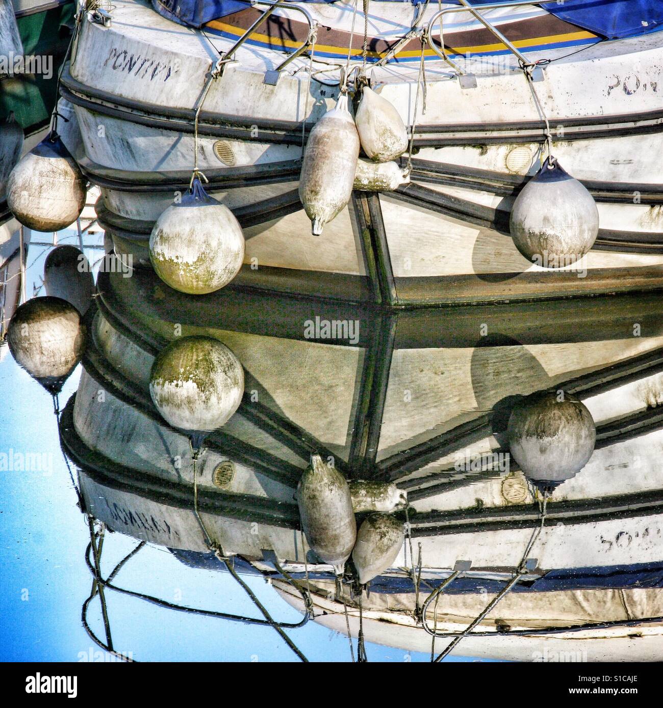 The reflection of a bow of a boat on a French canal Stock Photo - Alamy