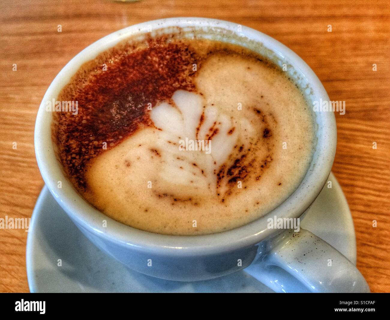 Latte coffee art close smartphone stock photos and images - Alamy