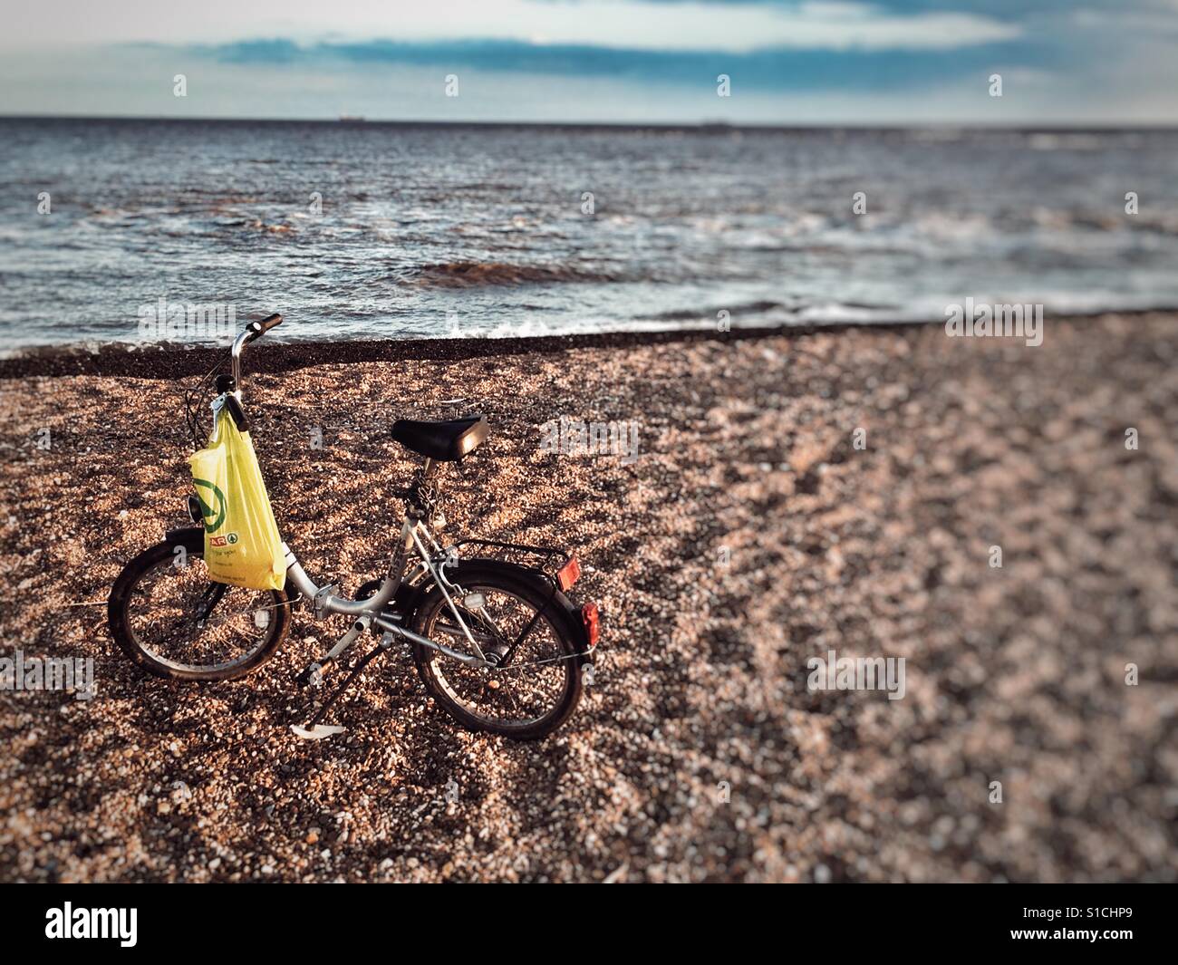 Bicycle on beach Stock Photo - Alamy