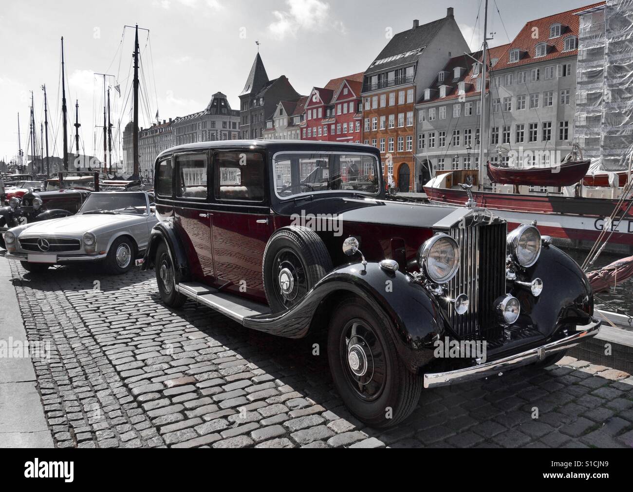 Vintage car at Nyhavn, old waterfront settlement of Copenhagen, Denmark ...