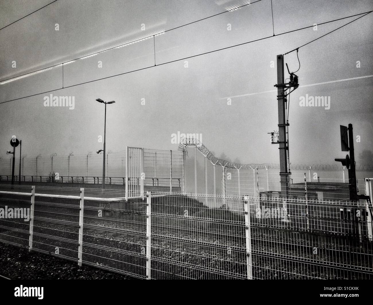Border fences at Calais train station Stock Photo - Alamy