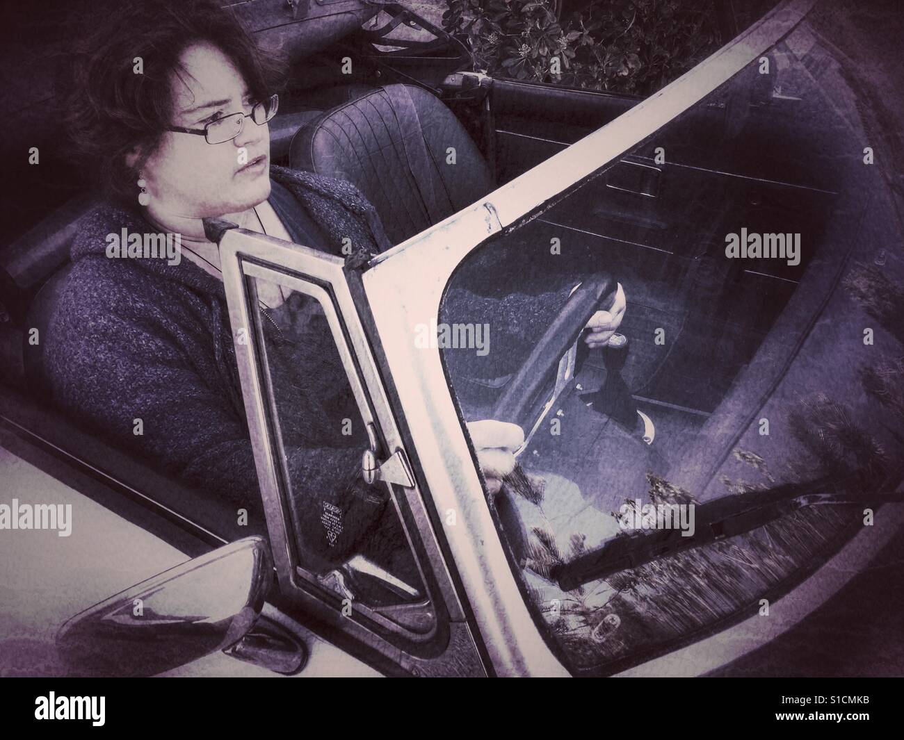 Young woman driving a 1973 MGB Roadster with the hood down Stock Photo ...