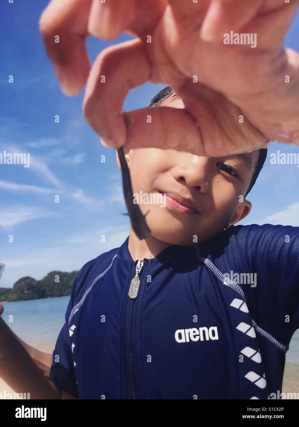 The boy with the fish hi-res stock photography and images - Alamy