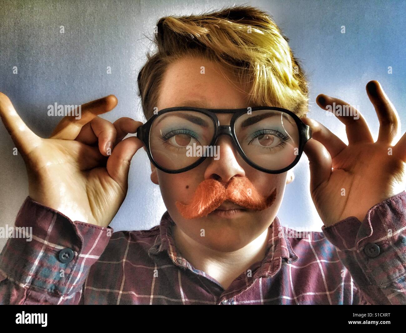 Boy wearing comedy moustache and glasses hi-res stock photography and ...