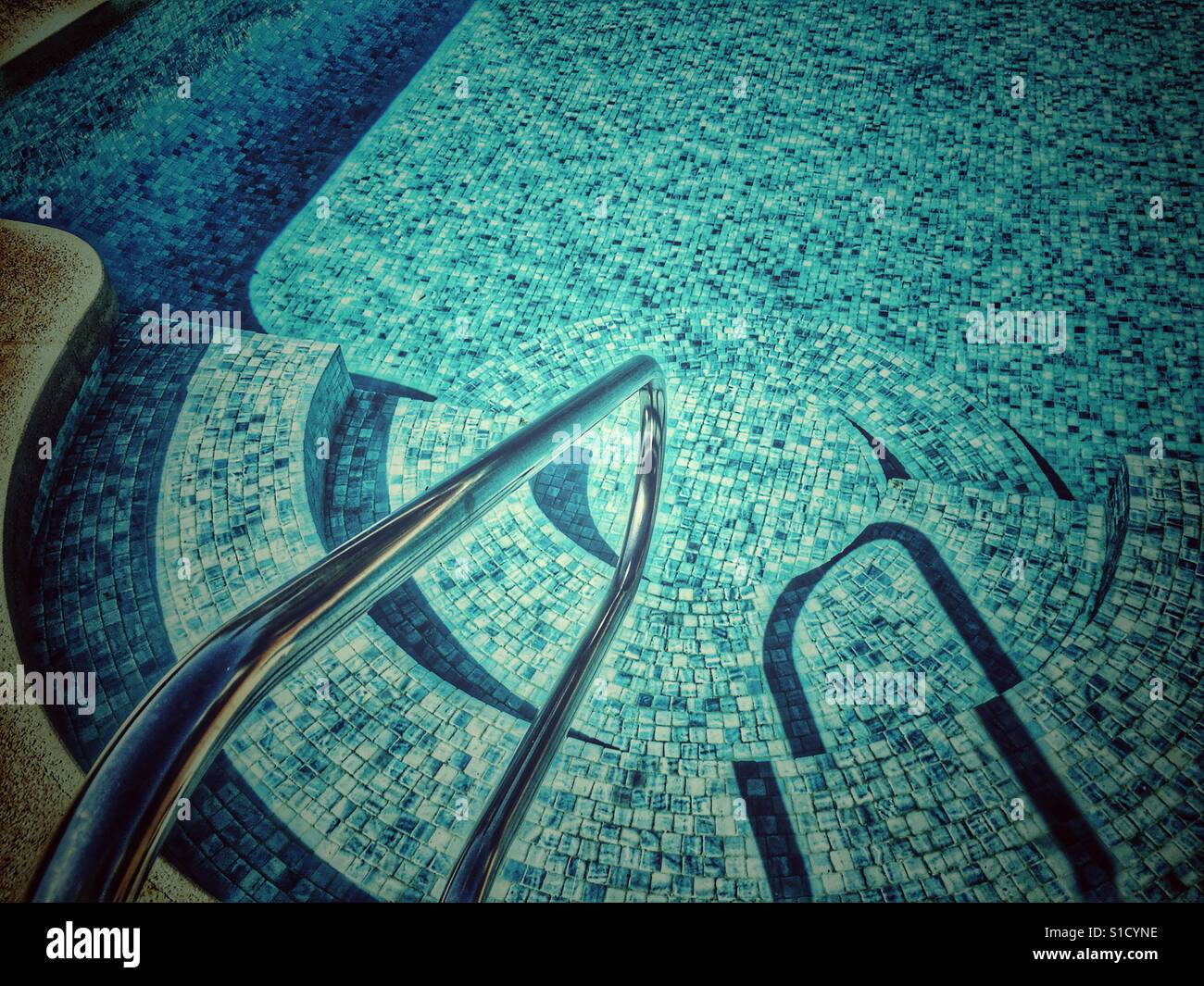 Swimming pool steps, handrail and shadows Stock Photo - Alamy
