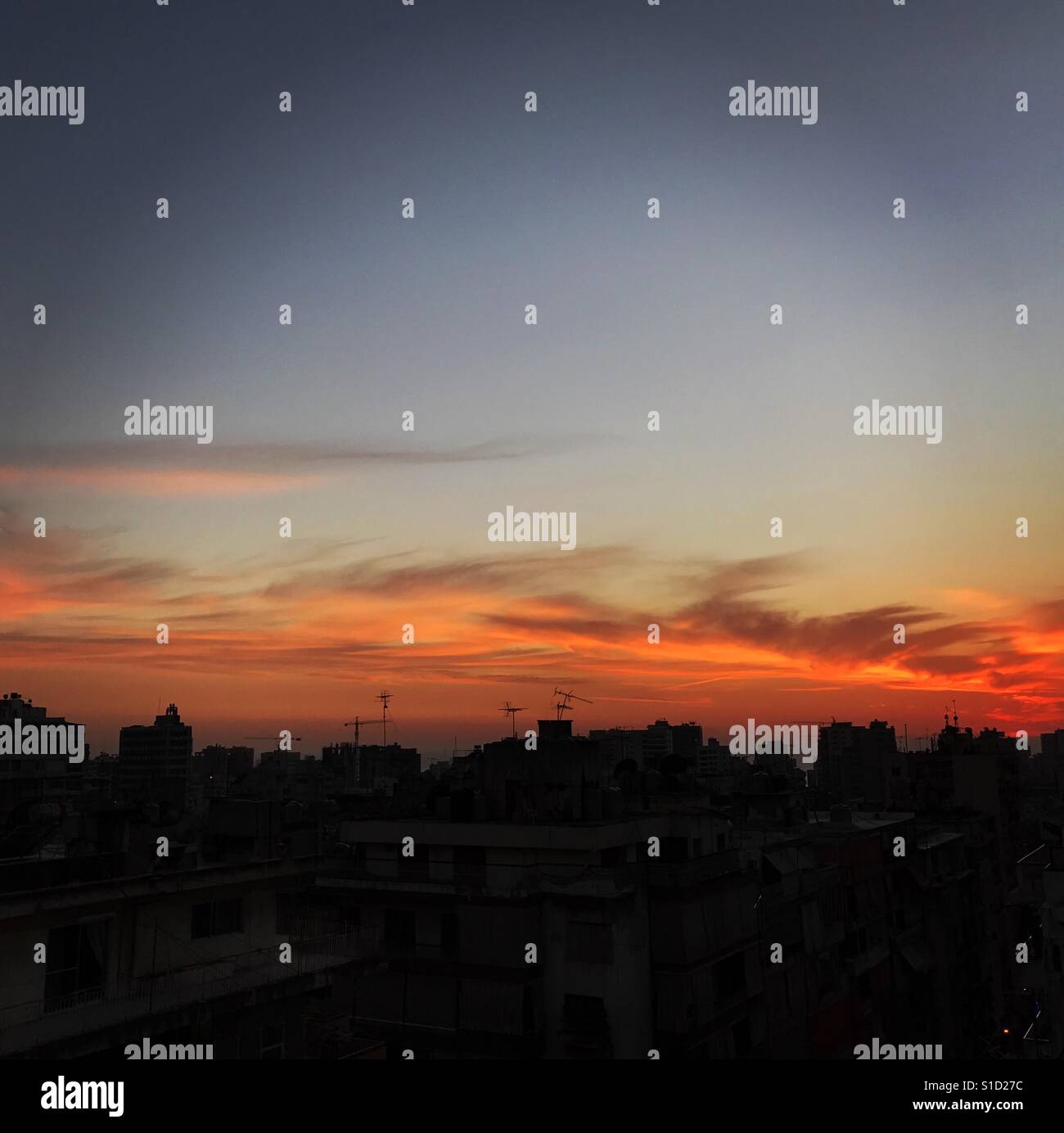 Sunset above cityscape Stock Photo - Alamy