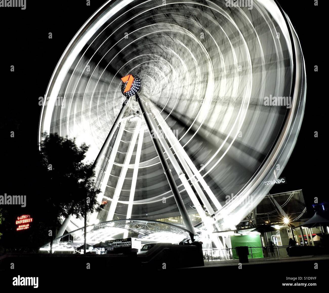 Spinning ferris wheel in motion at Brisbane river Australia Stock Photo ...