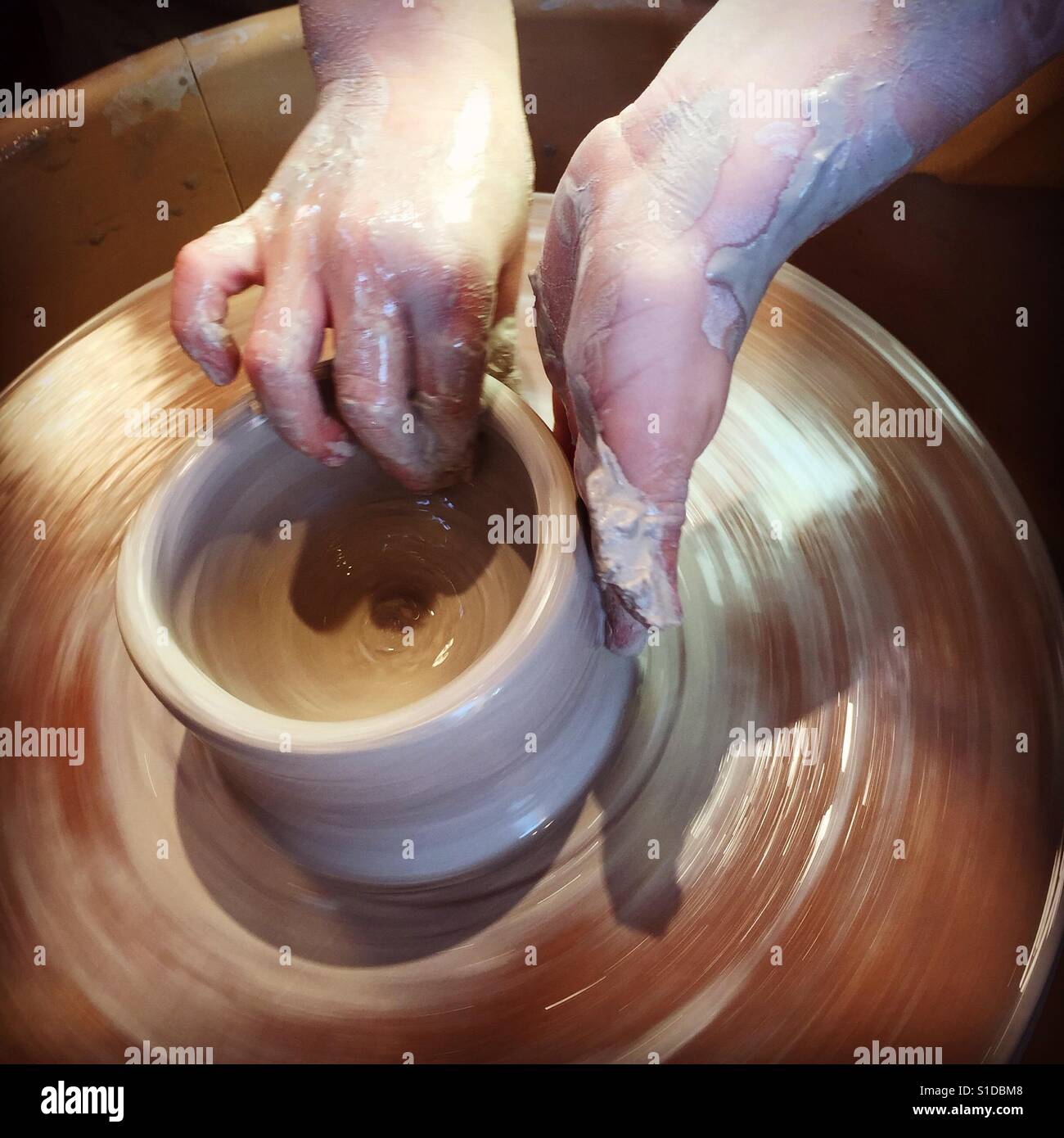Child's hands throwing a pot on a wheel Stock Photo - Alamy