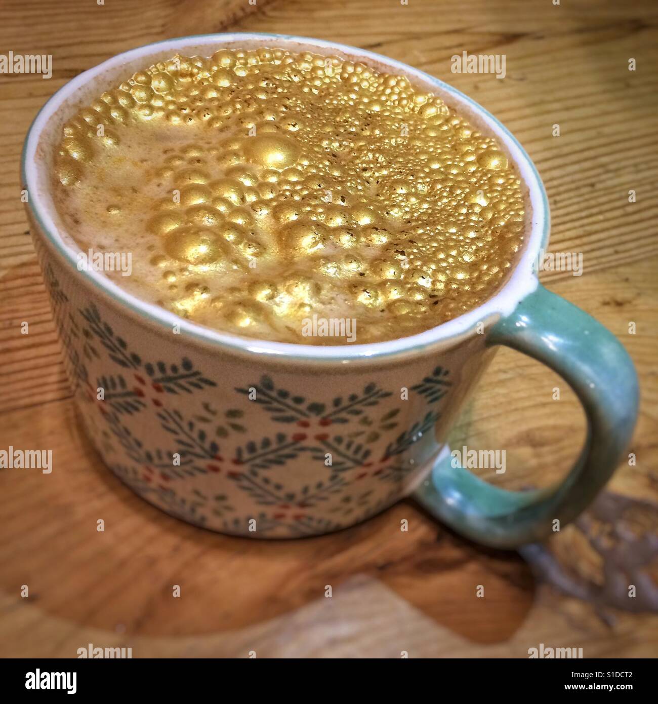 Gold chocolate drink Stock Photo - Alamy