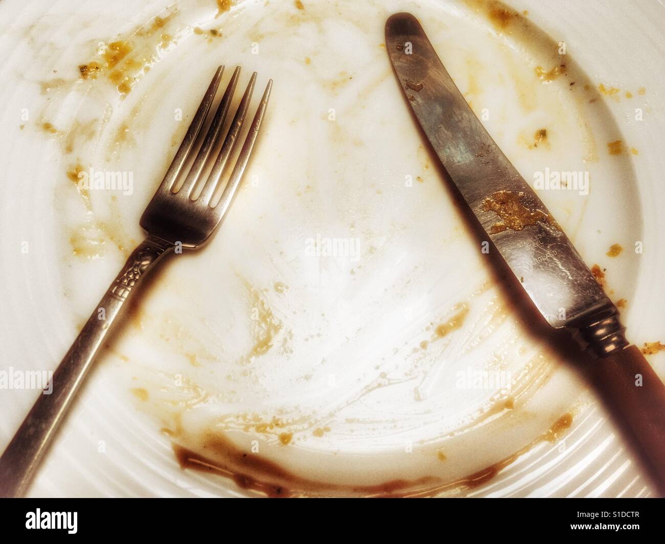 Empty plate after a meal Stock Photo - Alamy