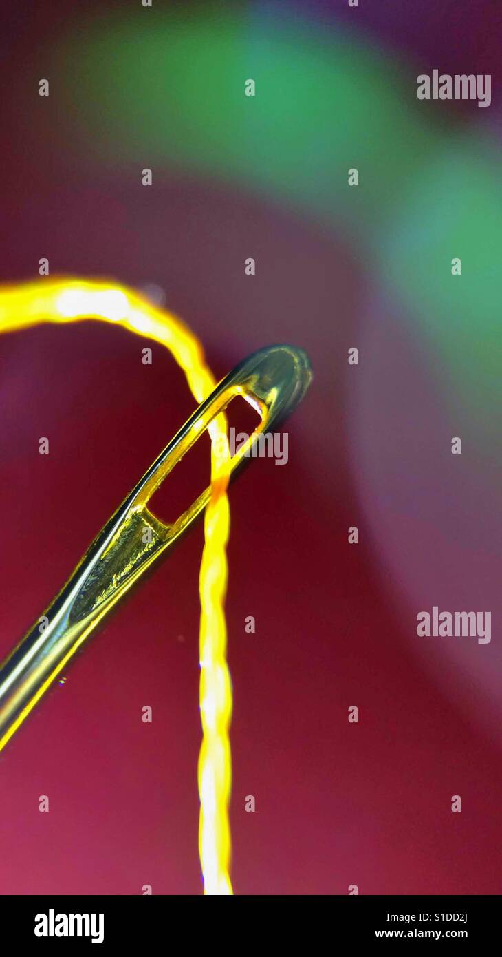 Needle and thread Stock Photo - Alamy