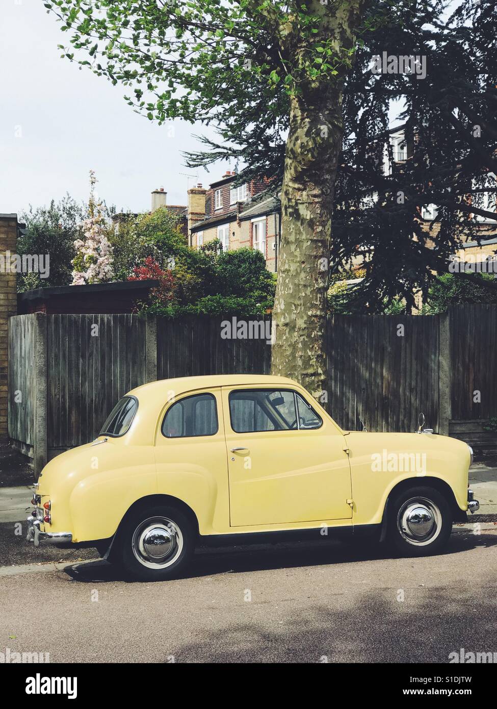A yellow Morris Minor car Stock Photo - Alamy