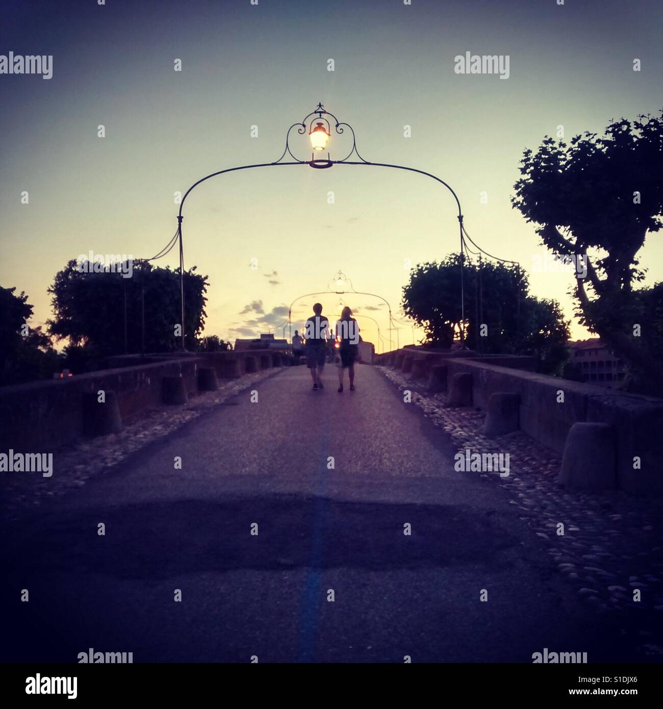 A couple Walking over bridge in carcassonne, France Stock Photo - Alamy