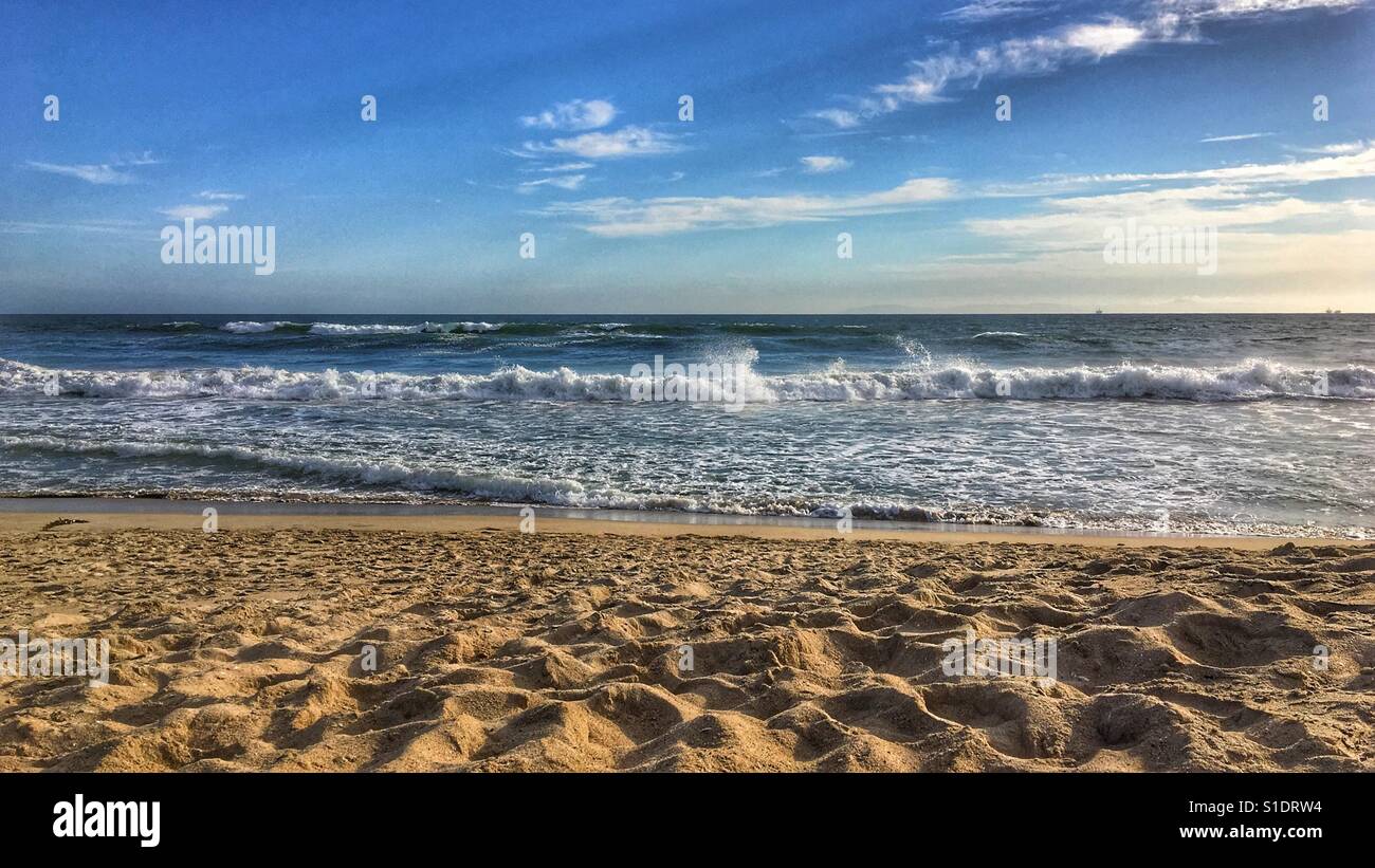 View of ocean and sky from a sandy beach. 16x9. Landscape. Space for ...
