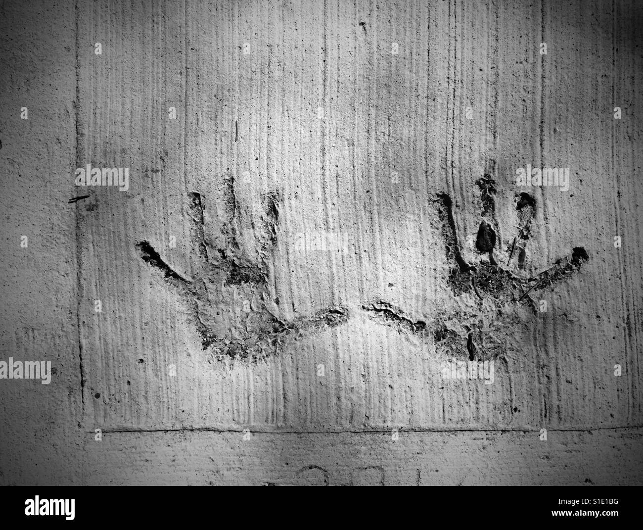 Hand print in concrete hi-res stock photography and images - Alamy