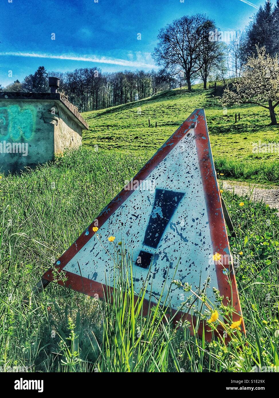 Warning sign in countryside Stock Photo - Alamy