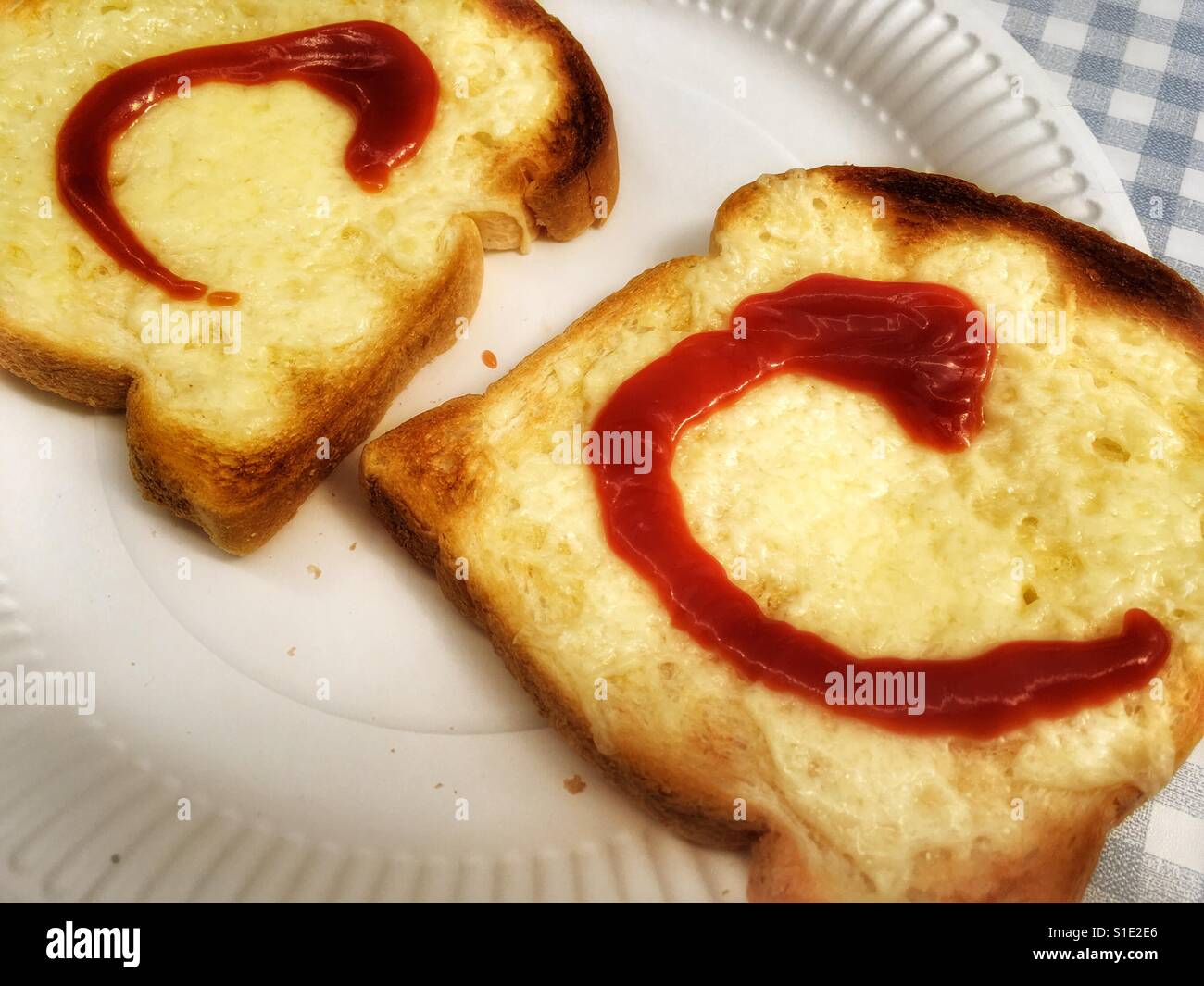 Cheese on toast with tomato ketchup Stock Photo - Alamy