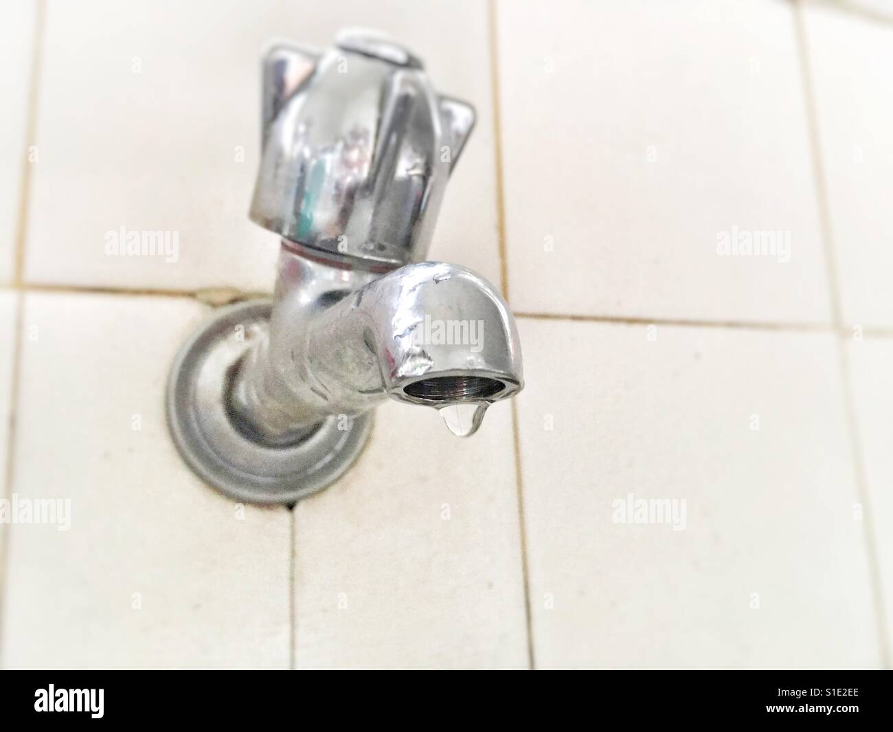 Water drop falling from a tap Stock Photo - Alamy