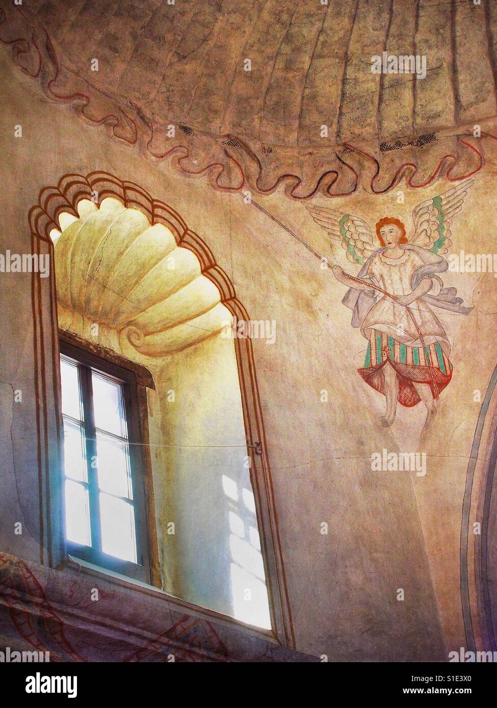 Detail of cornice shell window with light shining through at the ...