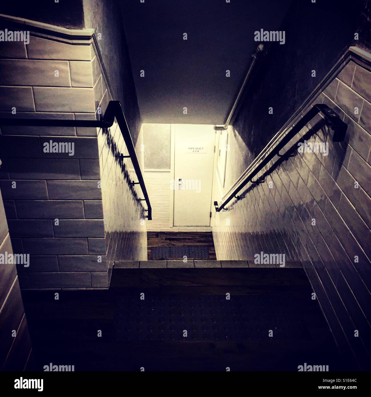 underground to basement stairs Stock Photo - Alamy