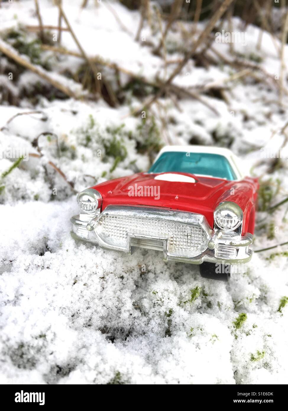 Red car in snow Stock Photo - Alamy