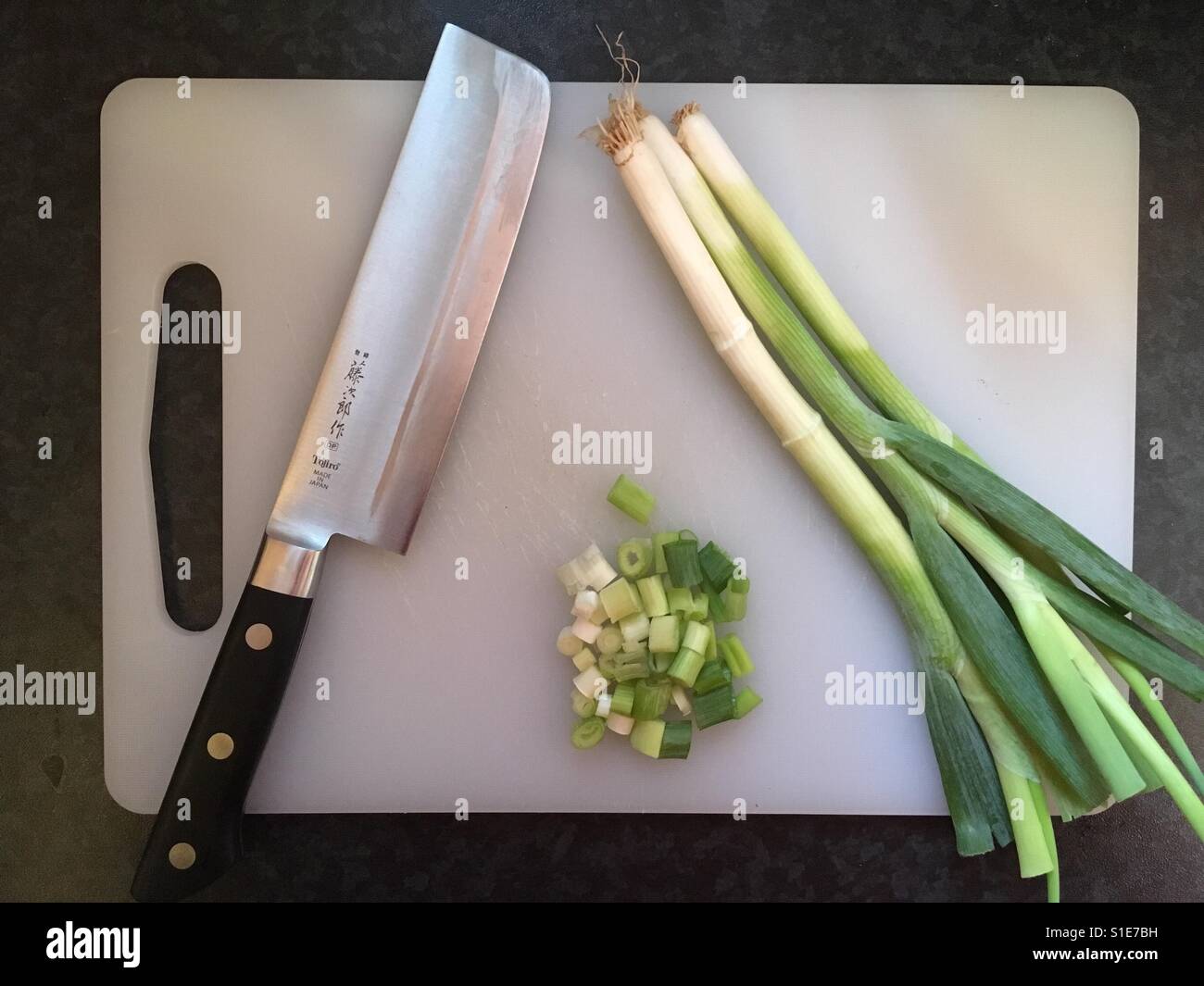 Spring onion preparation Stock Photo - Alamy