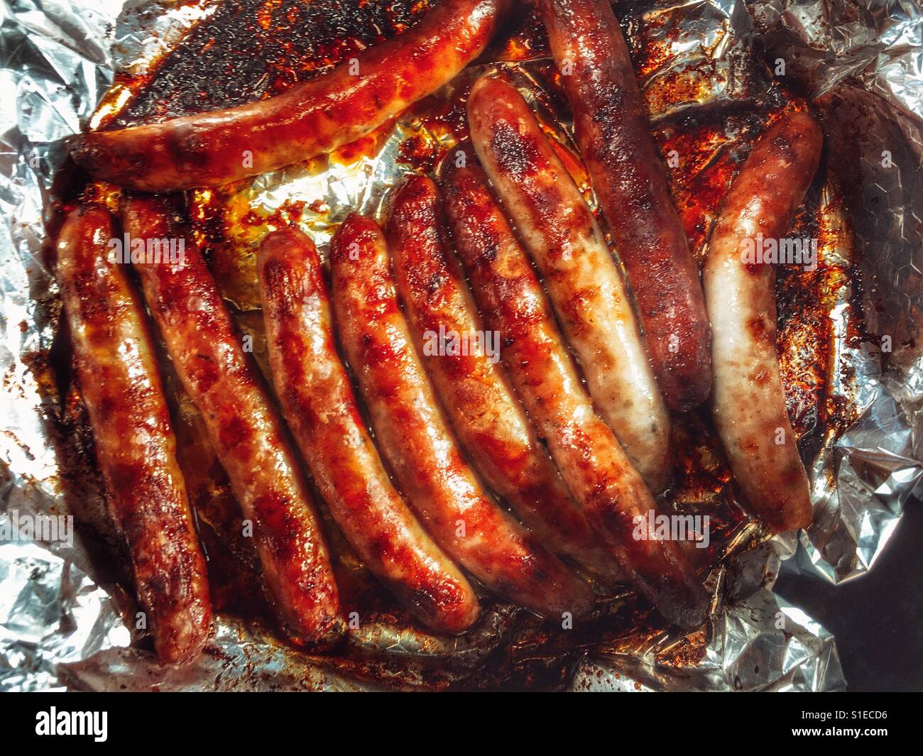 Grilled pork chipolata sausages Stock Photo - Alamy