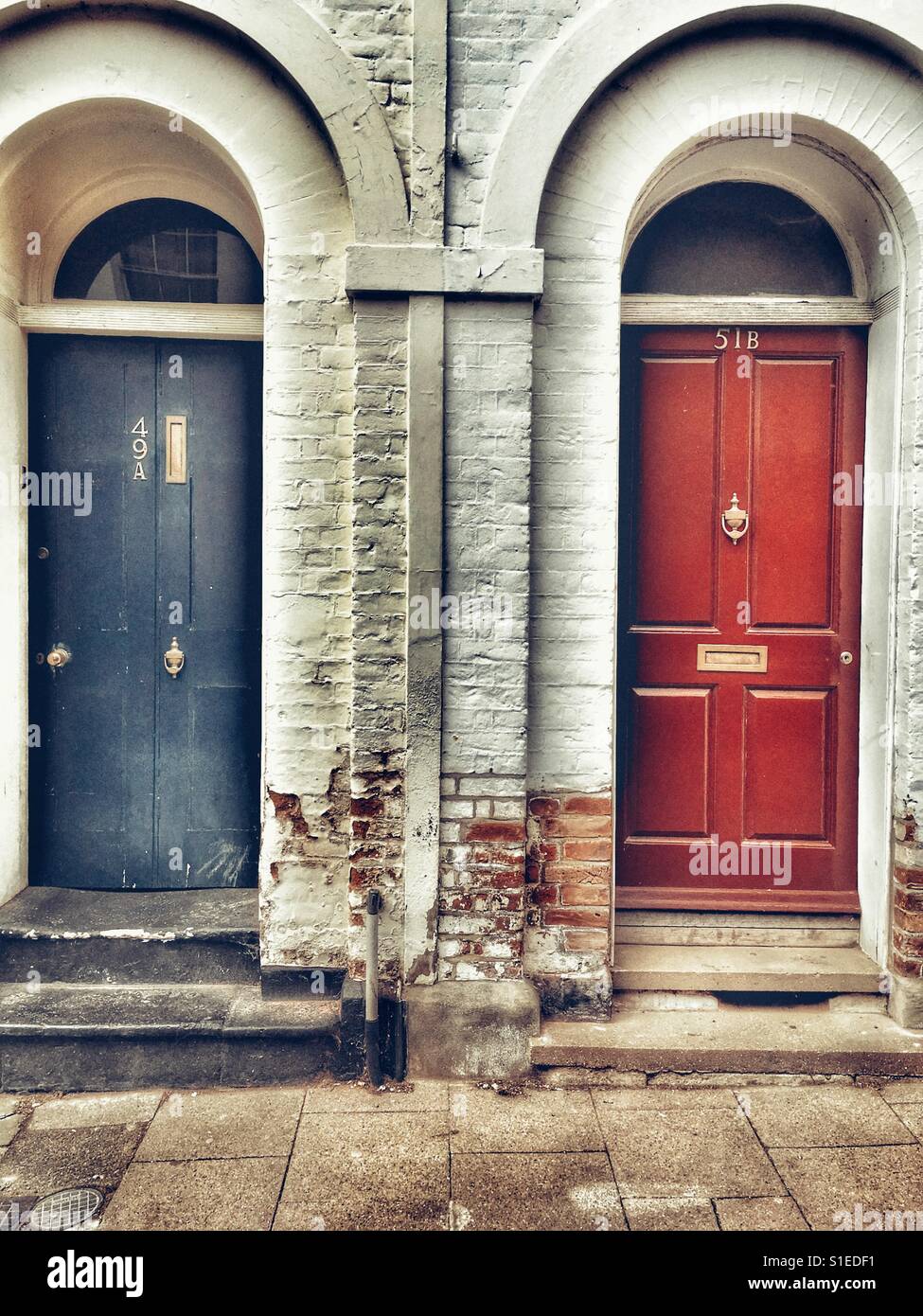 Blue & red front doors Stock Photo - Alamy