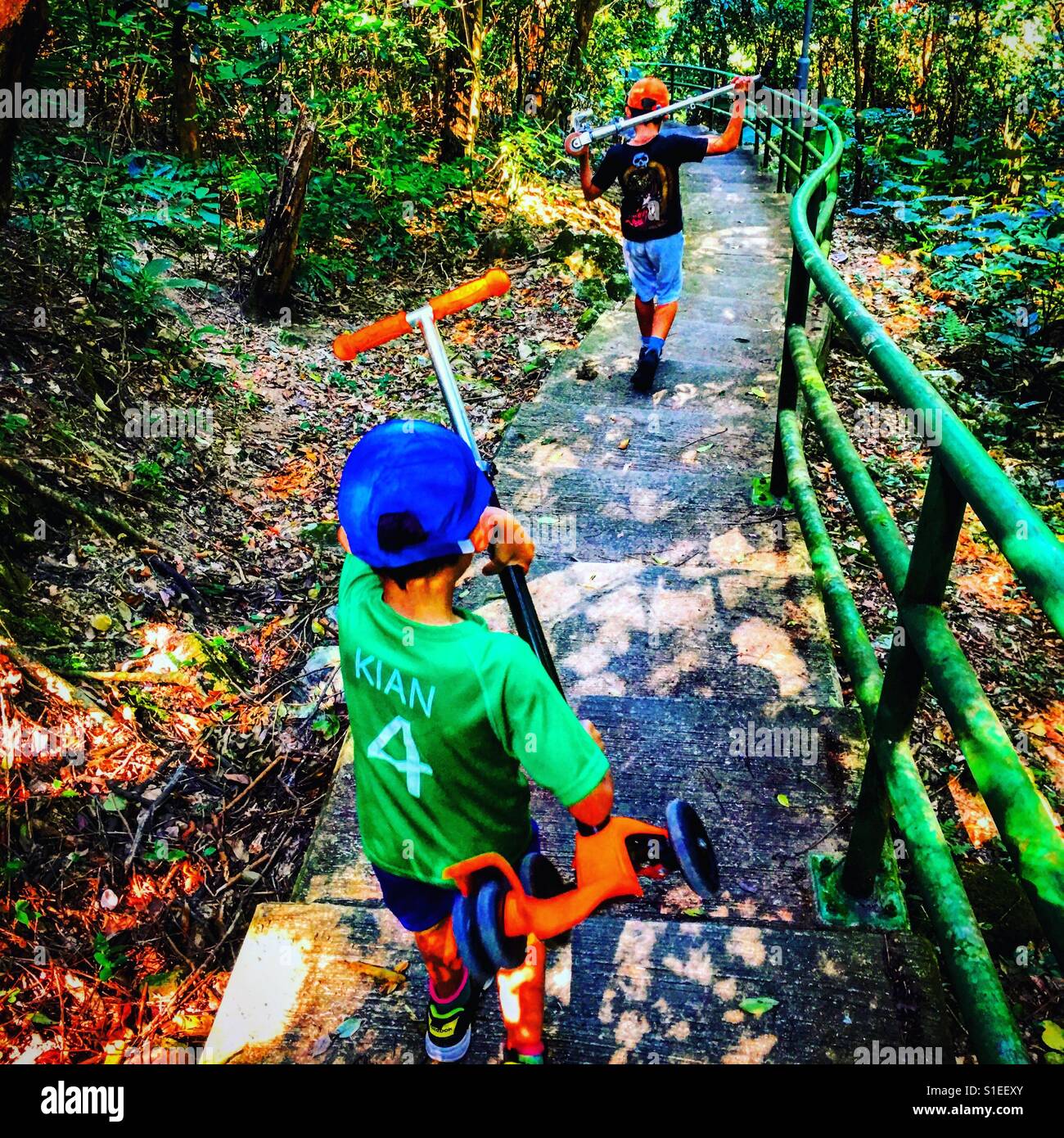 Two children walking down stairs hi-res stock photography and images ...