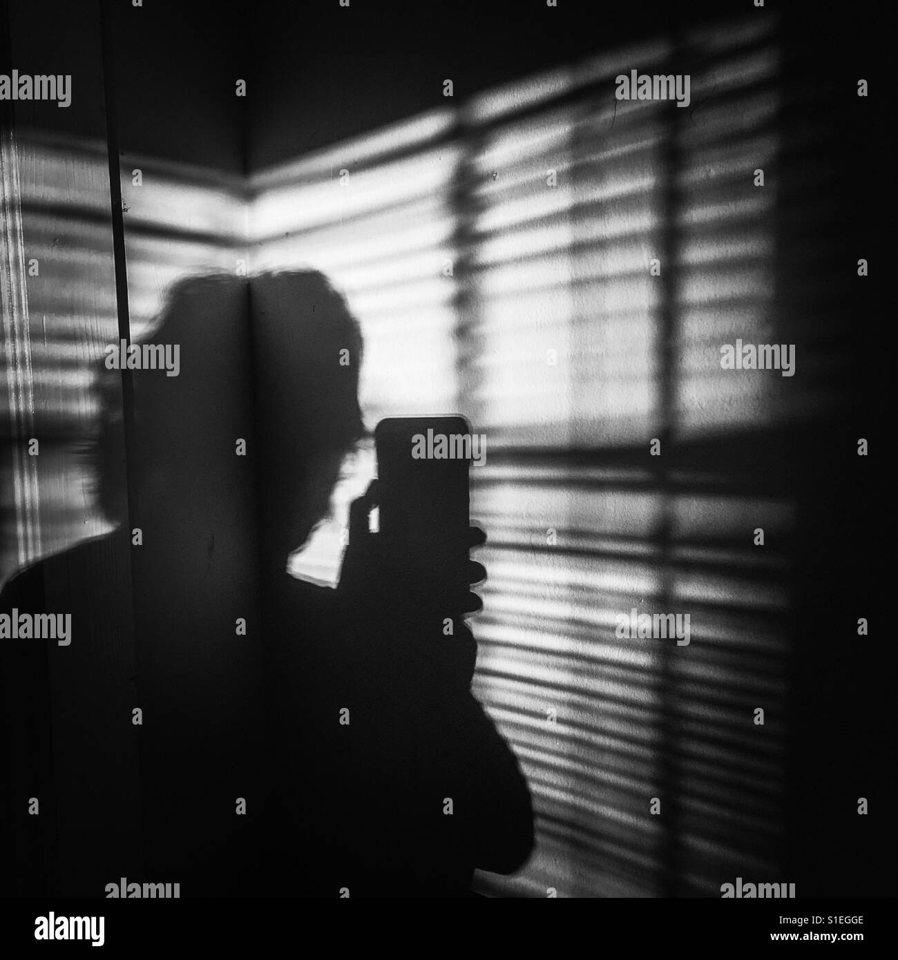 Self portrait in shadows hi-res stock photography and images - Alamy