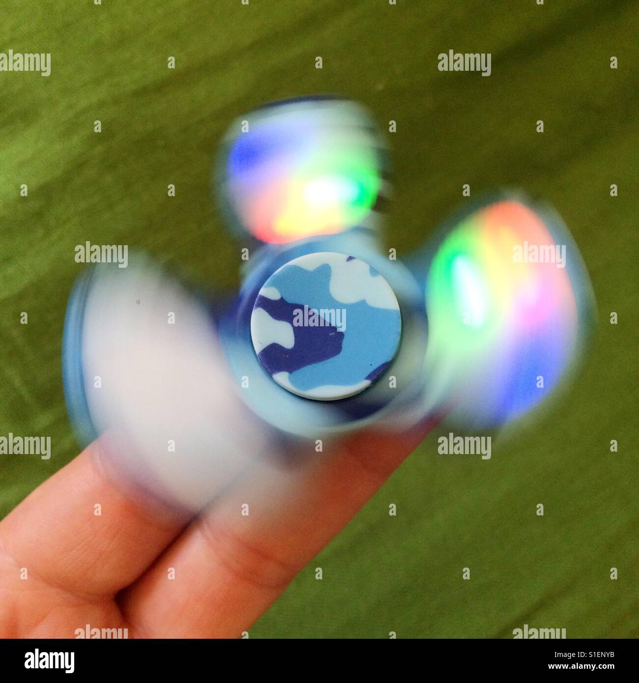 Led light up fidget spinner toy Stock Photo - Alamy