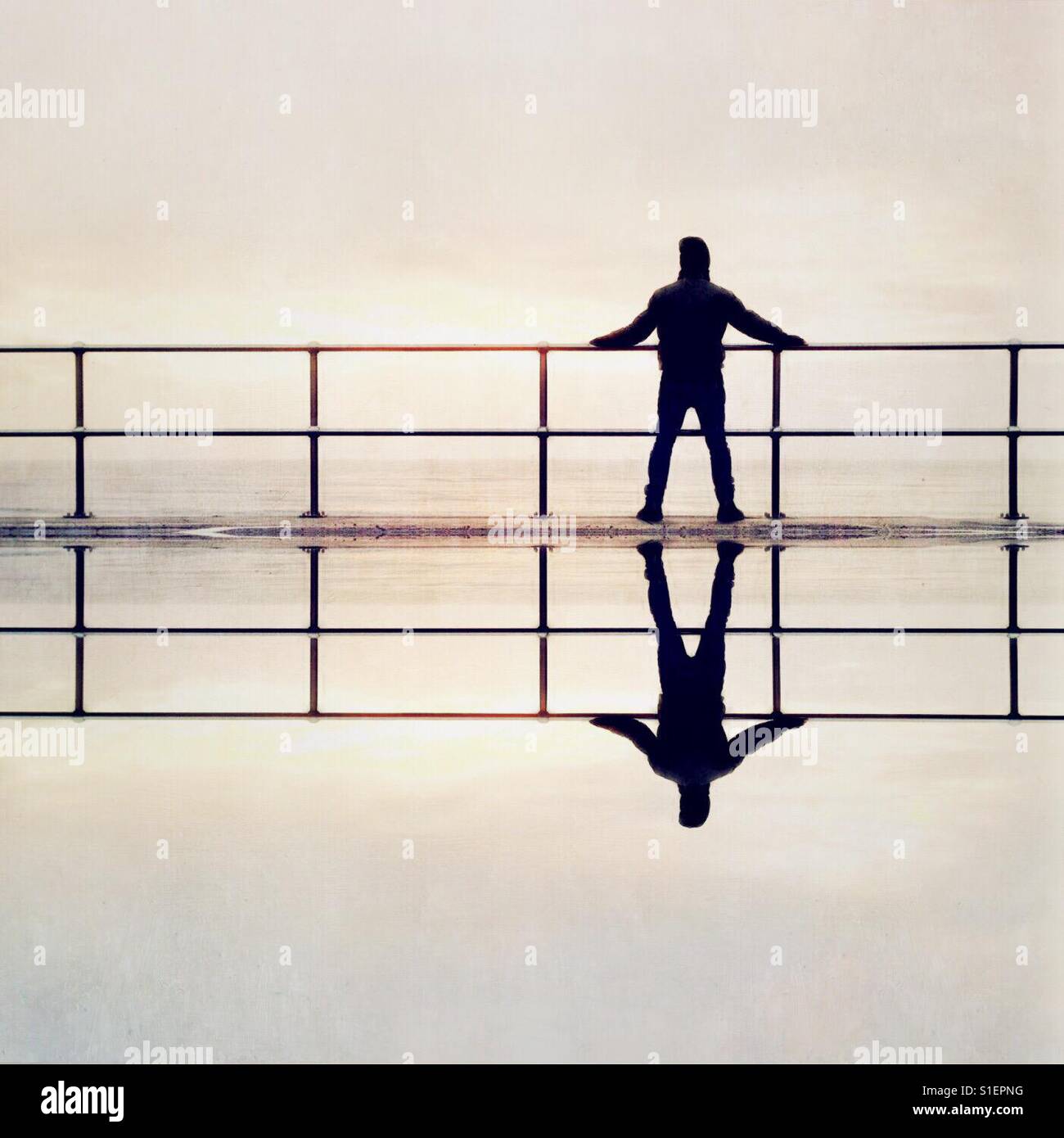 Figure looking out to sea Stock Photo - Alamy