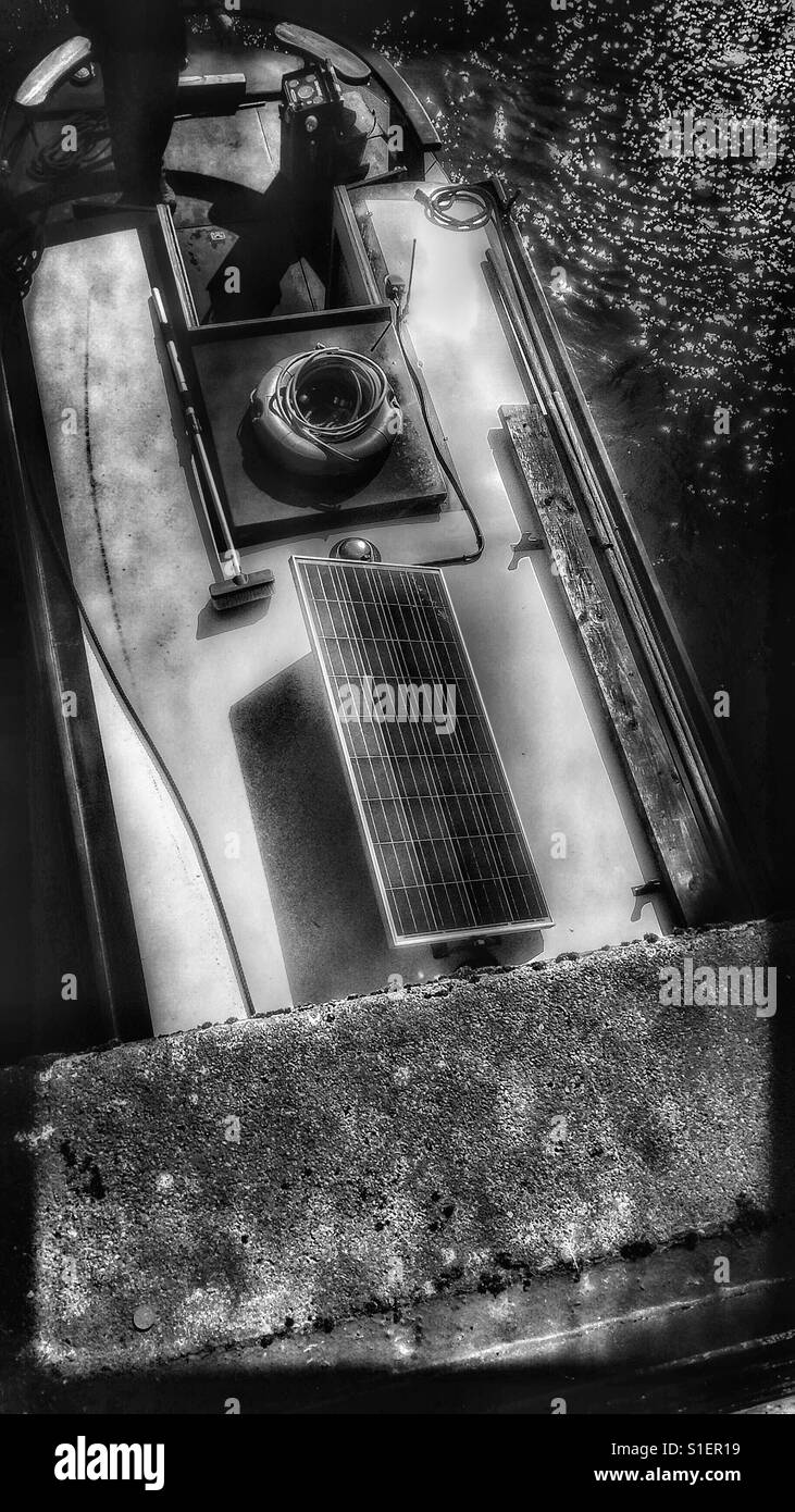 Barge with solar panel being steered under bridge, Nottingham, England ...