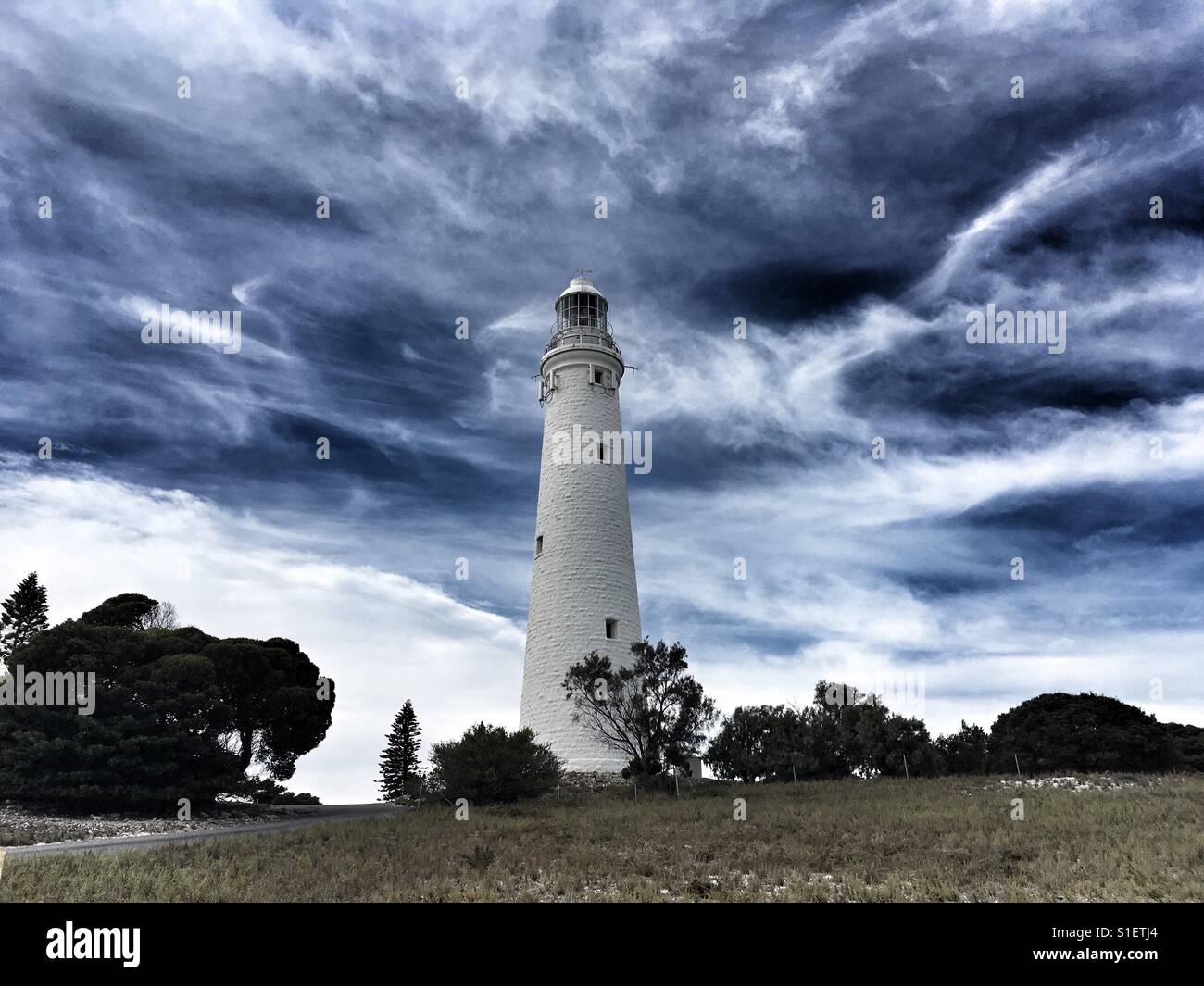 Lighthouse with blue sky background Stock Photo - Alamy