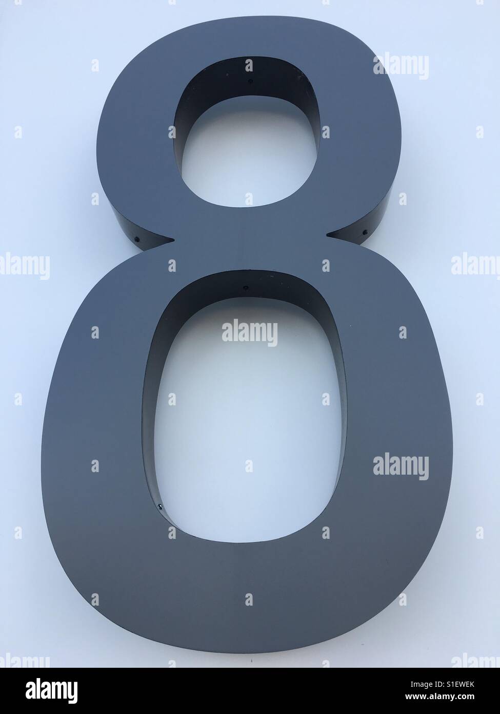 Giant eight (8) on outer wall of building Stock Photo - Alamy