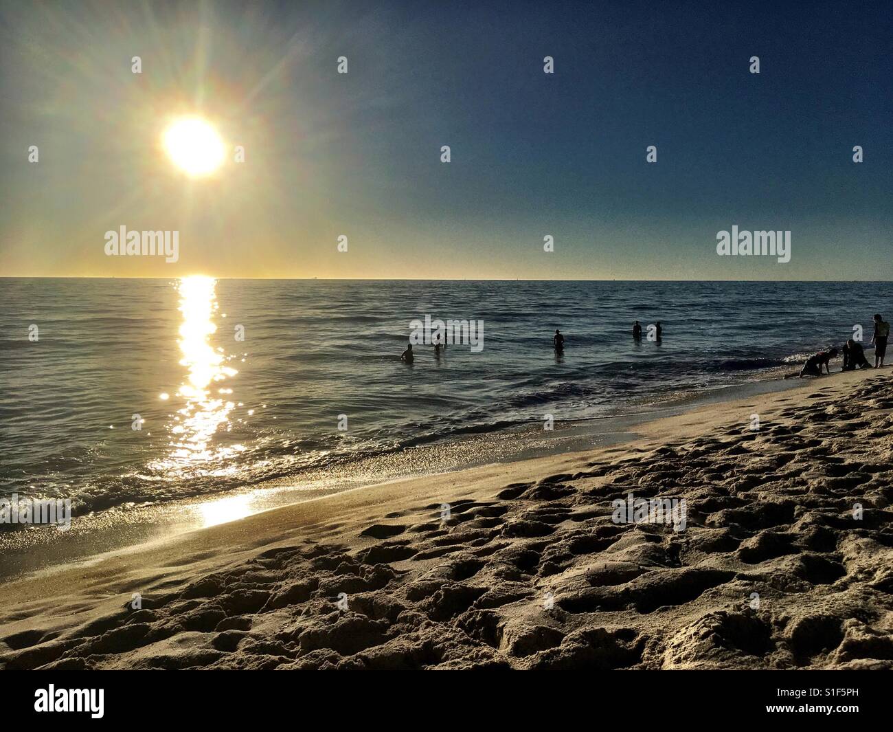 Swimming at beach hi-res stock photography and images - Alamy