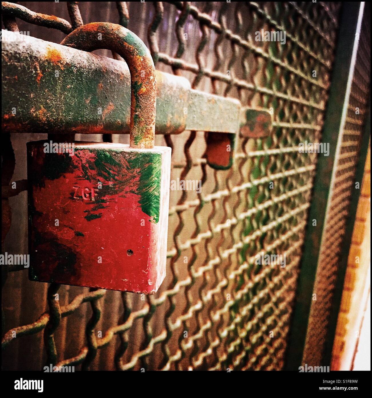 A close up of a rusty old lock securing a door Stock Photo - Alamy