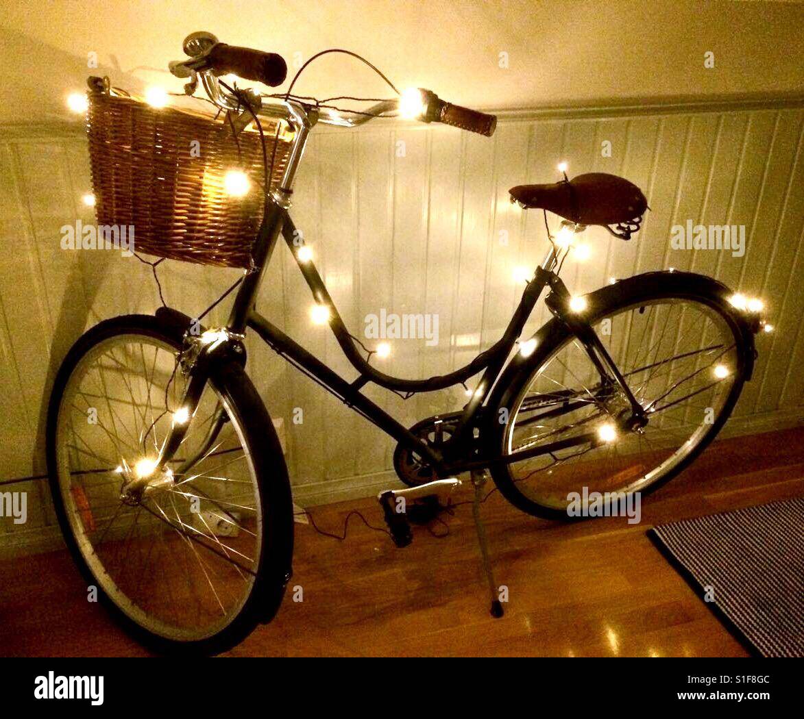 Bicycle with fairy lights Stock Photo - Alamy