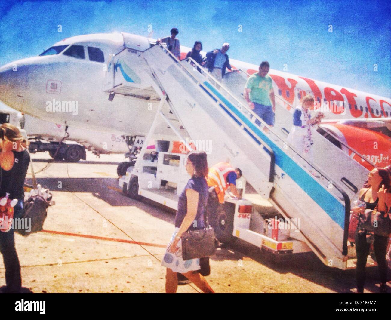 Disembarking plane hi-res stock photography and images - Alamy