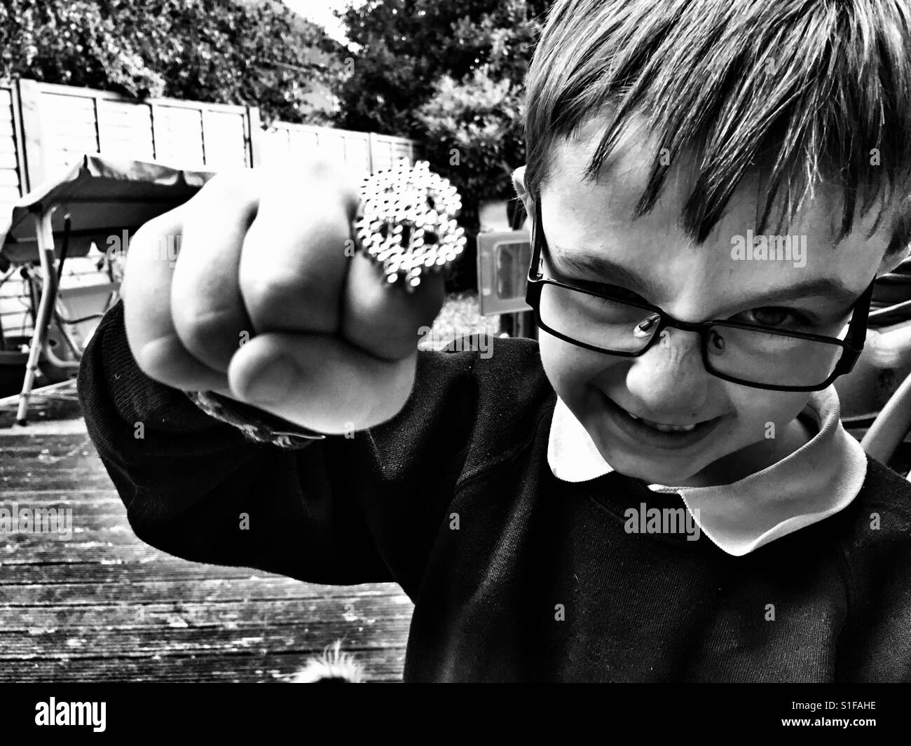 Boy wearing pimp $ ring Stock Photo - Alamy