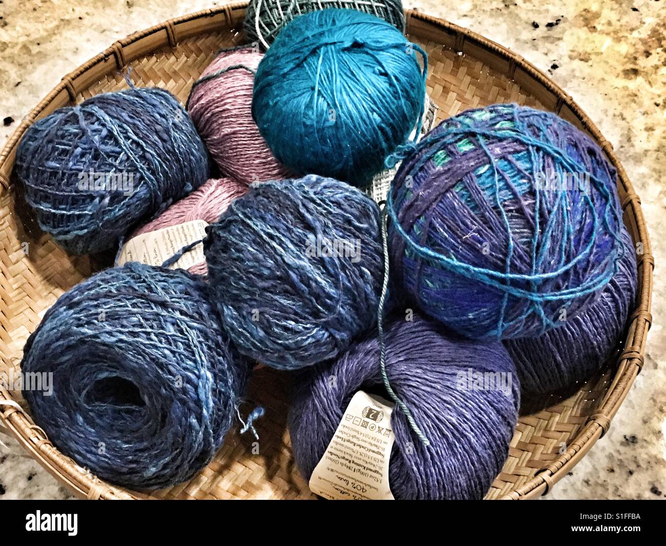 Yarn balls in basket Stock Photo - Alamy
