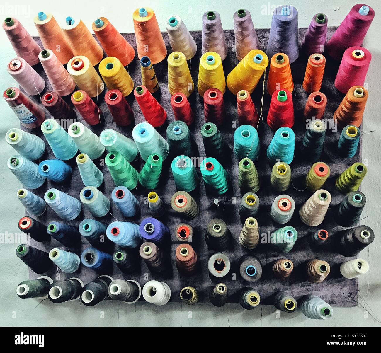 Thread board, full view faded colors Stock Photo - Alamy