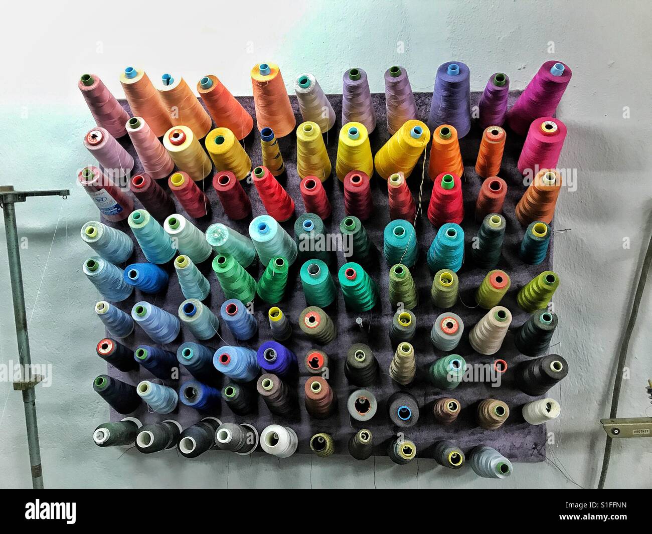 Thread board on the wall Stock Photo - Alamy