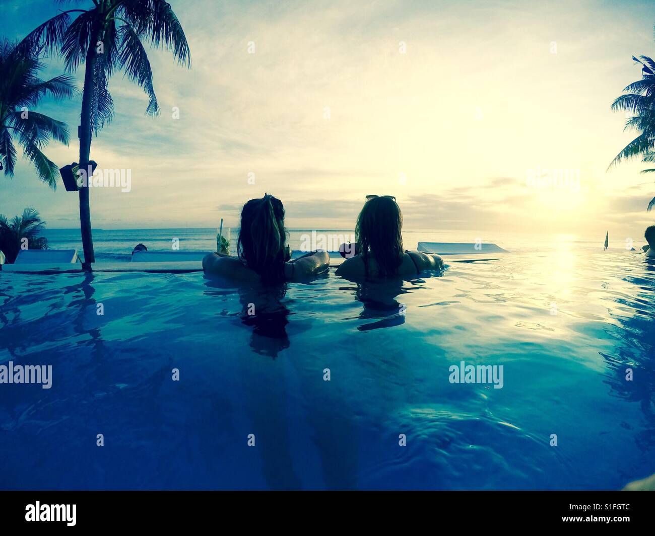 Chilling by the pool hi-res stock photography and images - Alamy