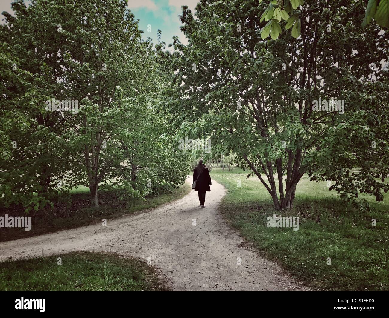 Walking in the garden Stock Photo - Alamy
