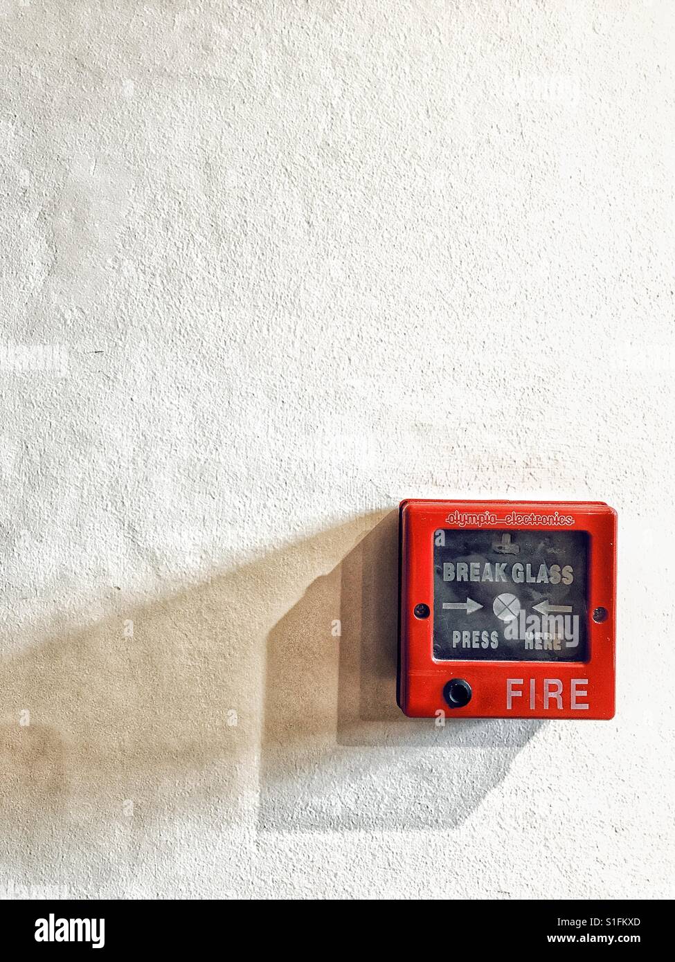 Fire alarm switch on the wall Stock Photo - Alamy