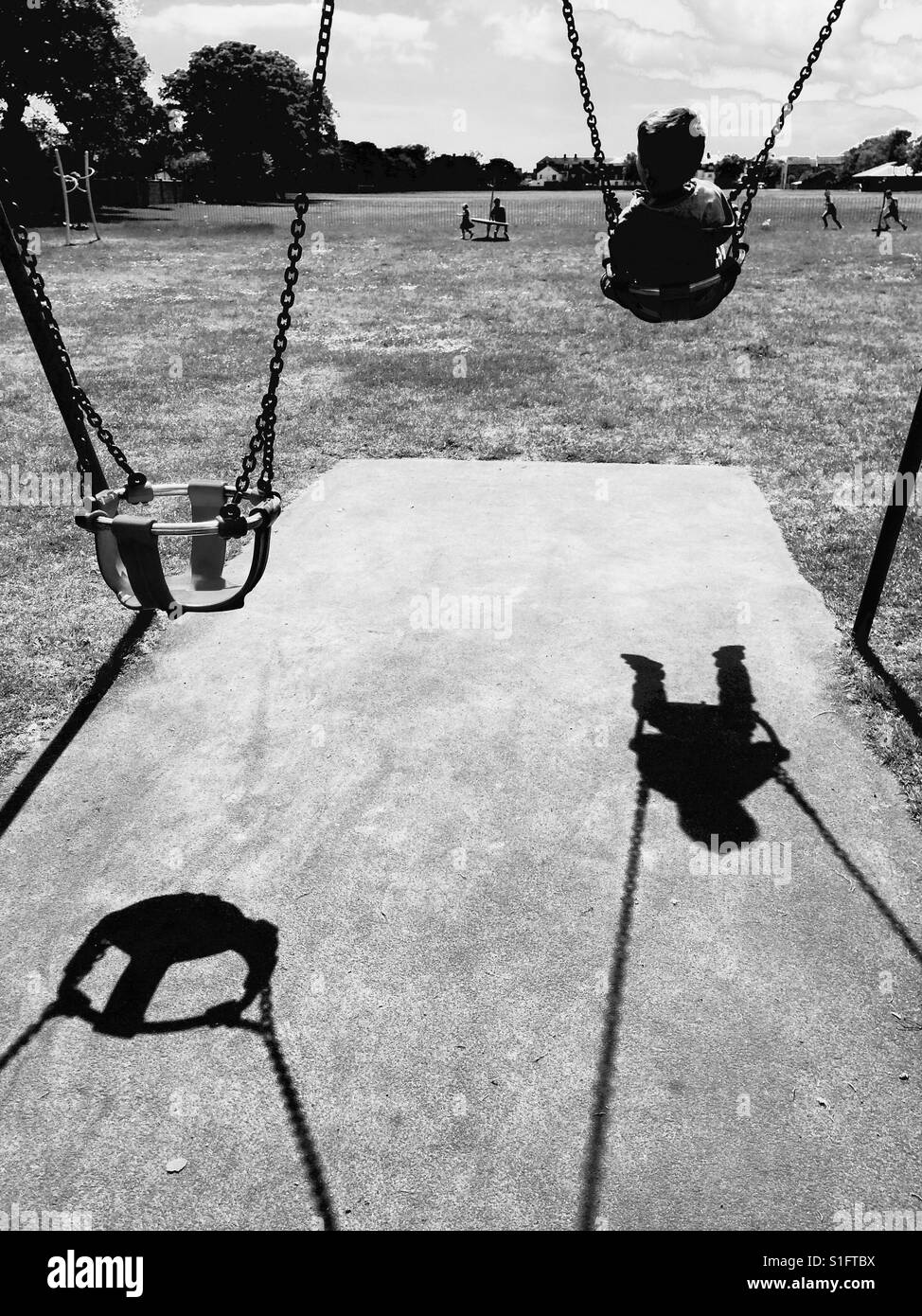 Children Playing Park Swings High Resolution Stock Photography and Images - Alamy