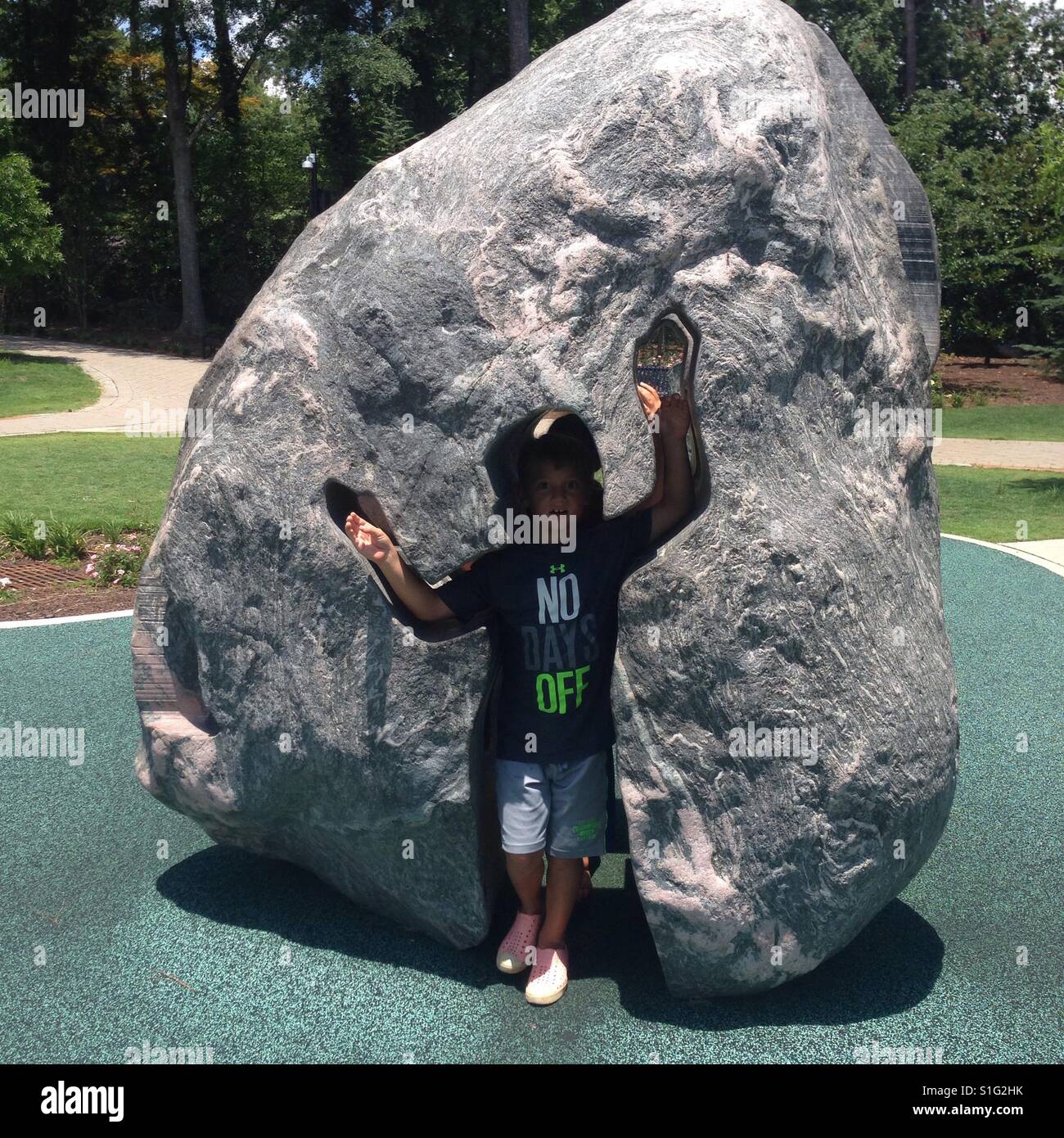 Grandson in a rock sculpture Stock Photo - Alamy